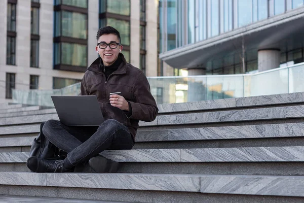 happy male Asian student programmer freelancer smile with laptop and ...