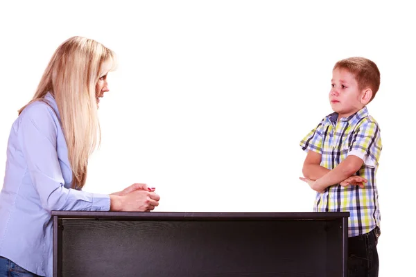 Mother and son talk and argue sit at table. Stock Photo by ©Voyagerix ...