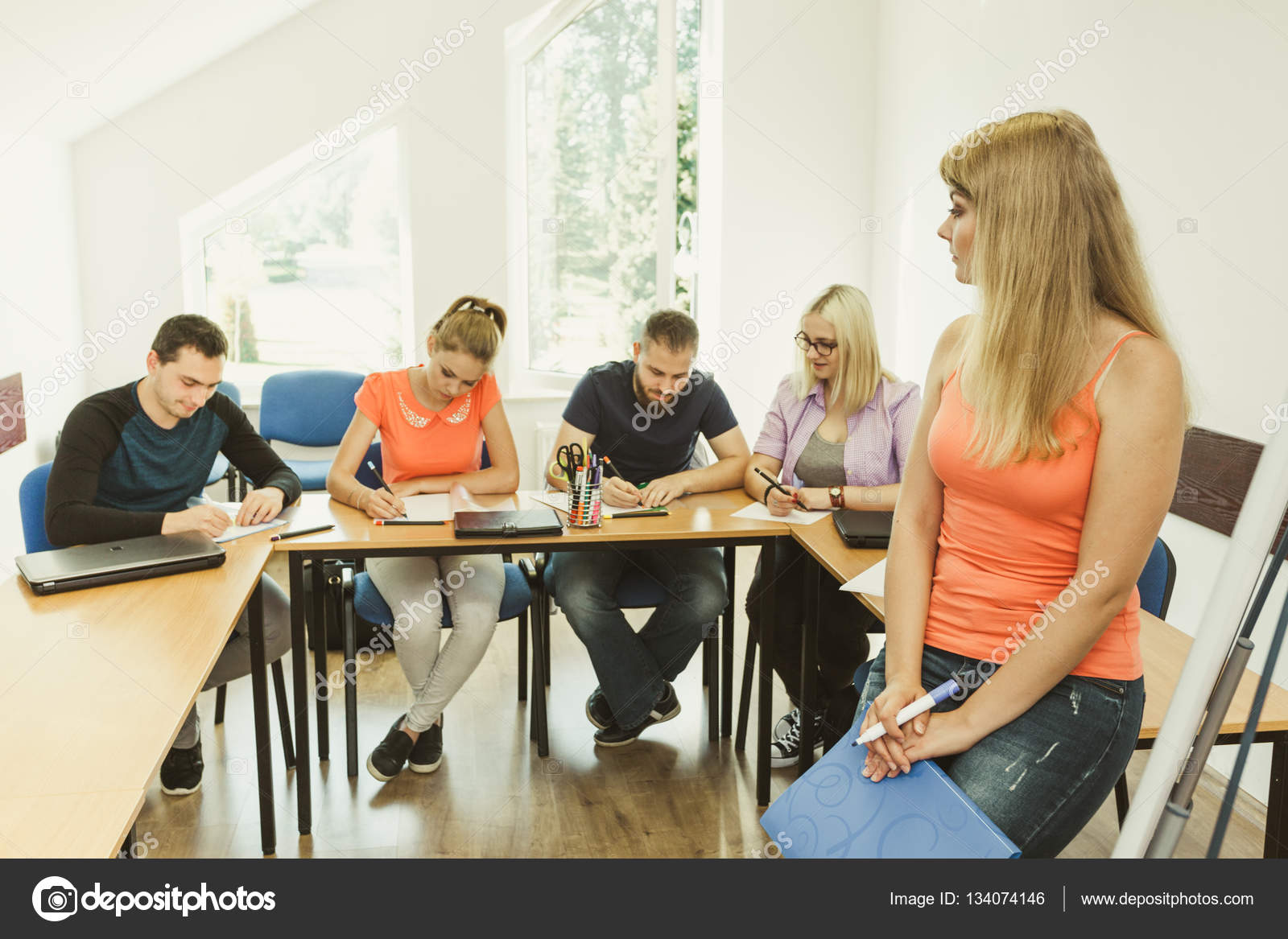 Students in classroom during the break Stock Photo by ©Voyagerix 134074146
