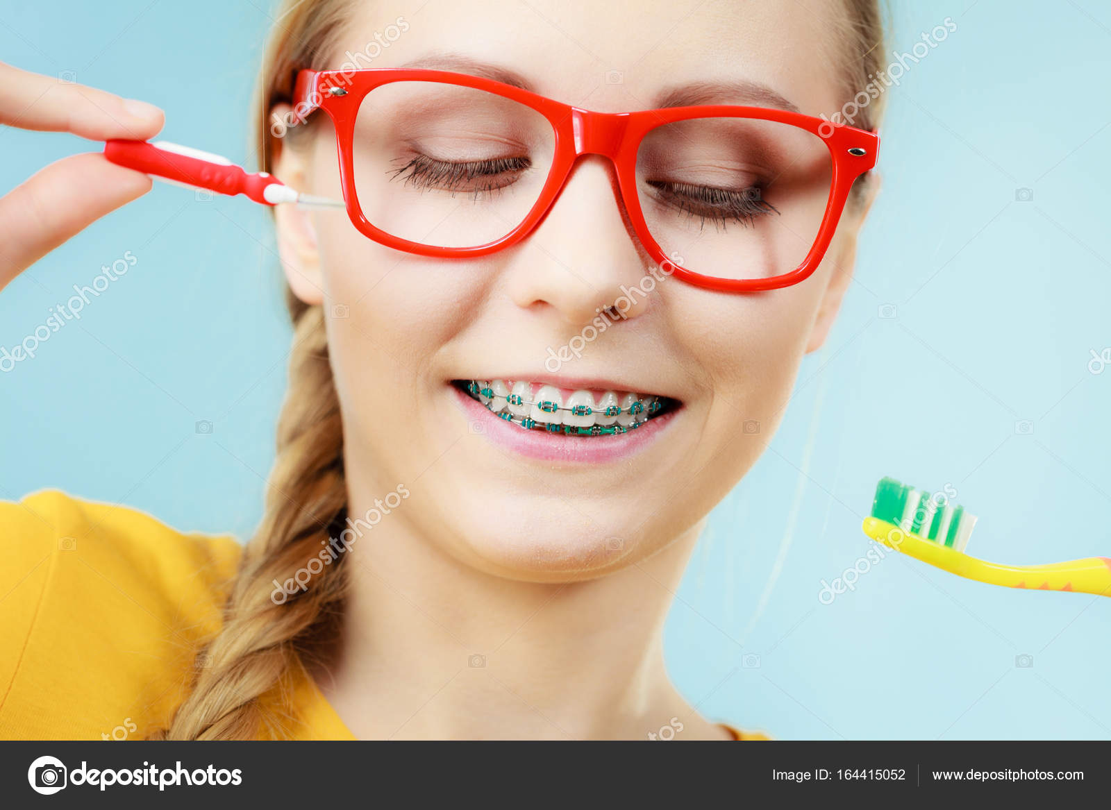 Girl with teeth braces using interdental and traditional brush — Stock ...