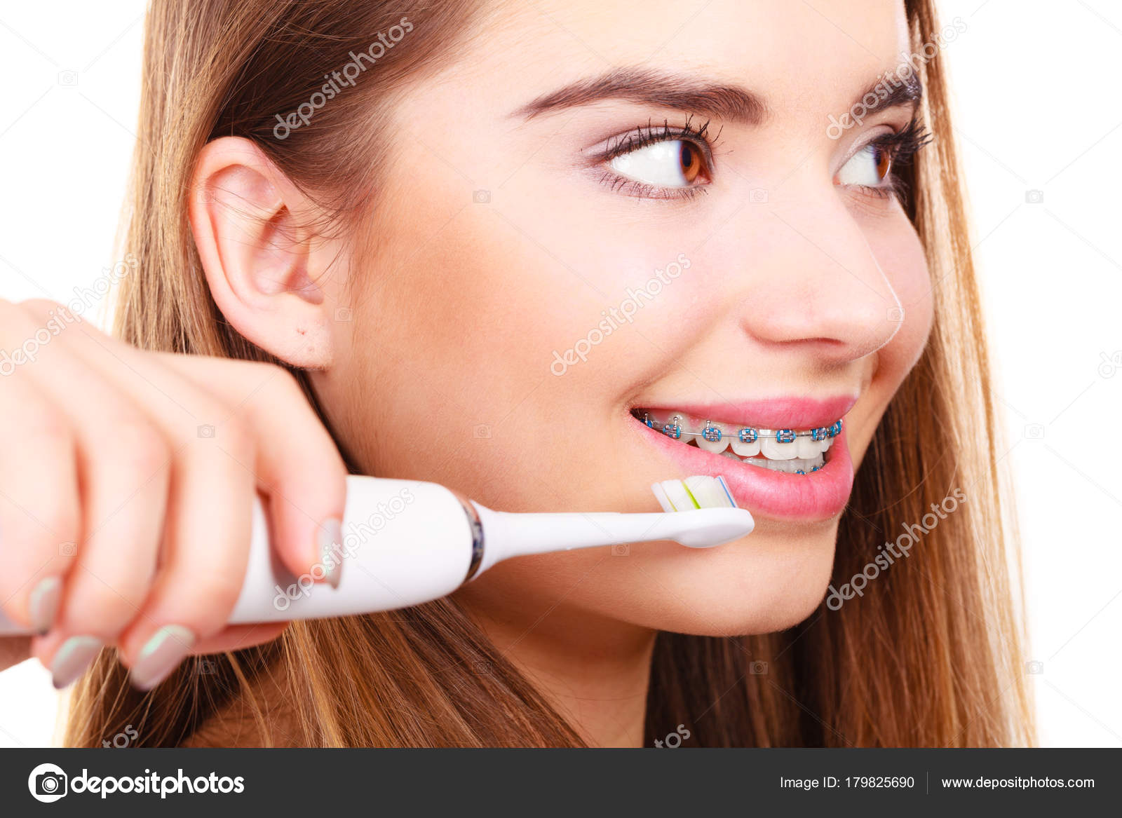 Woman brushing teeth with braces using brush Stock Photo by ©Voyagerix ...