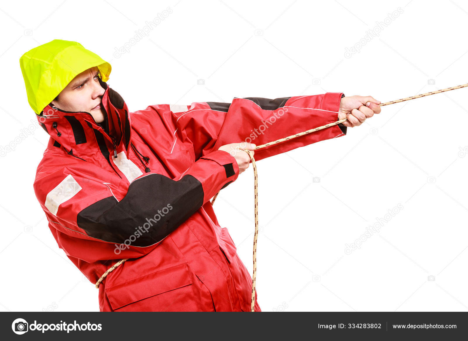 Young man pulling a rope Stock Photo by ©Voyagerix 334283802