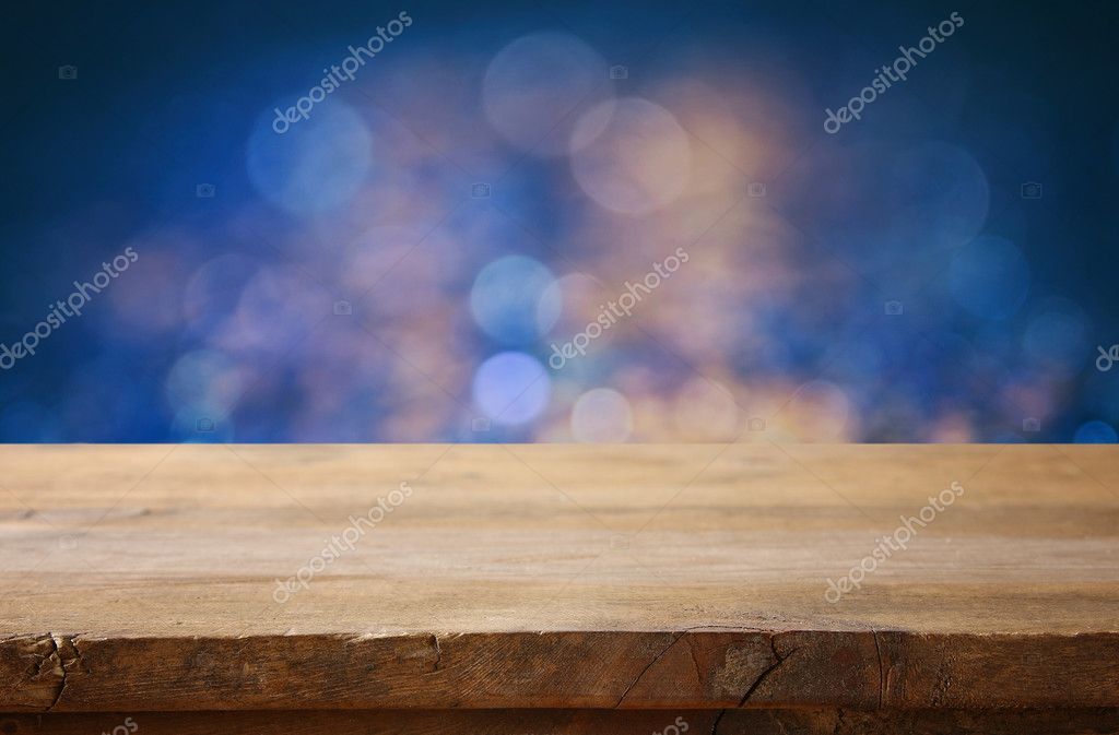 Empty table in front of blue glitter lights background — Stock Photo ...