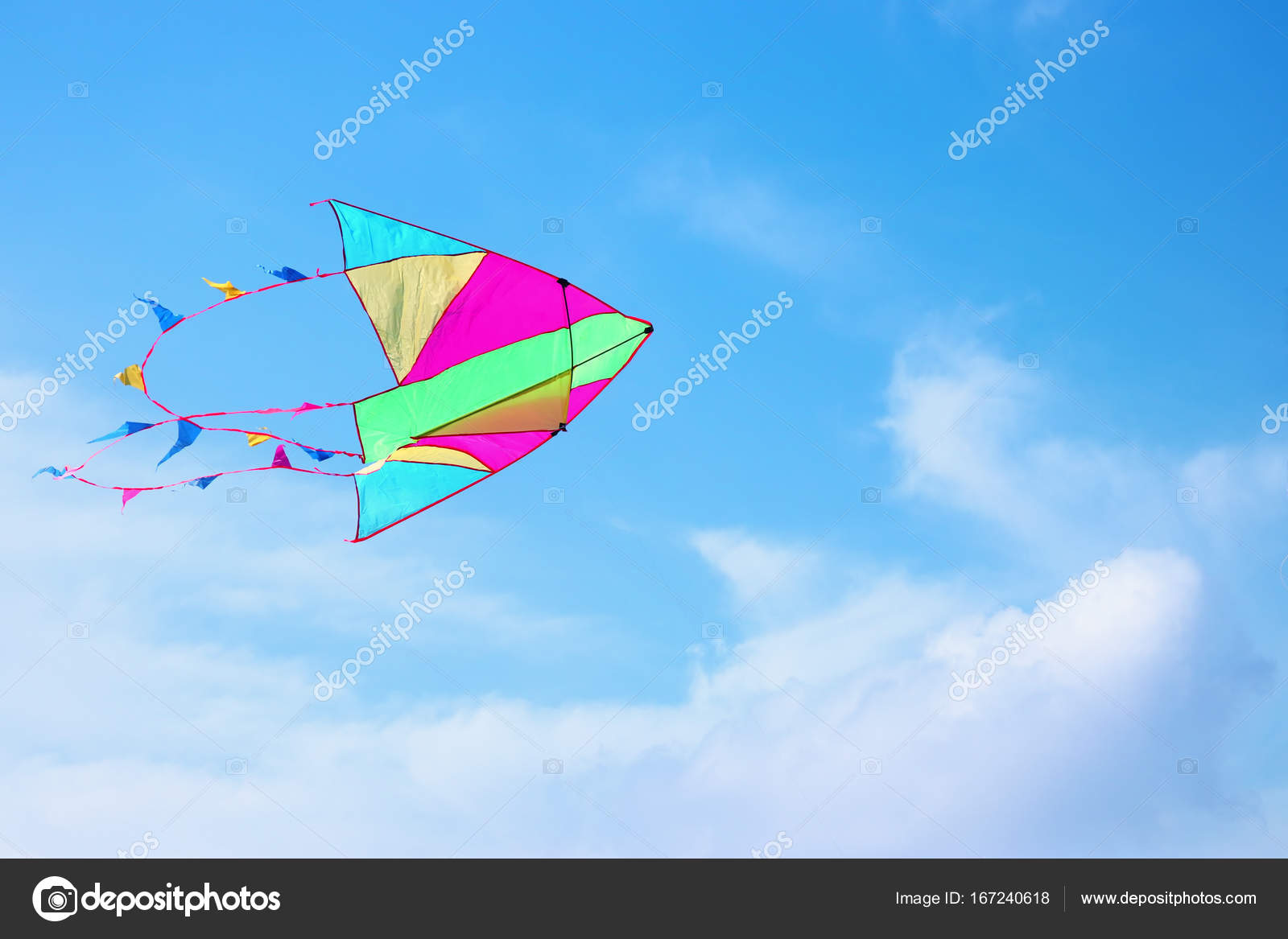 Colorful kite flying in the blue sky through the clouds — Stock Photo ...