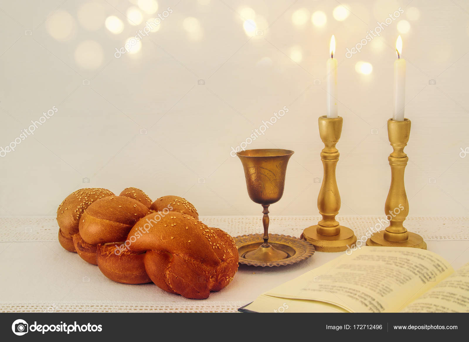 Shabbat image. challah bread, shabbat wine and candles on the table ...
