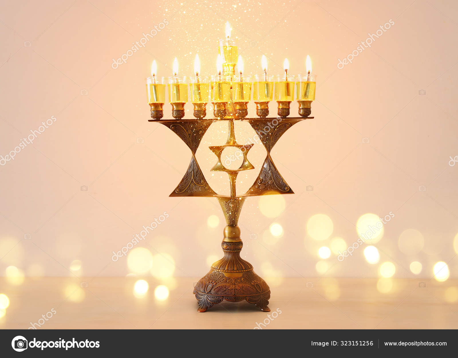 Religion image of jewish holiday Hanukkah background with bronze david ...