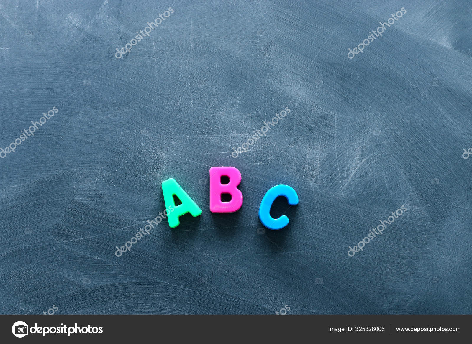 ABC letters over blackboard background — Stock Photo © tomert #325328006
