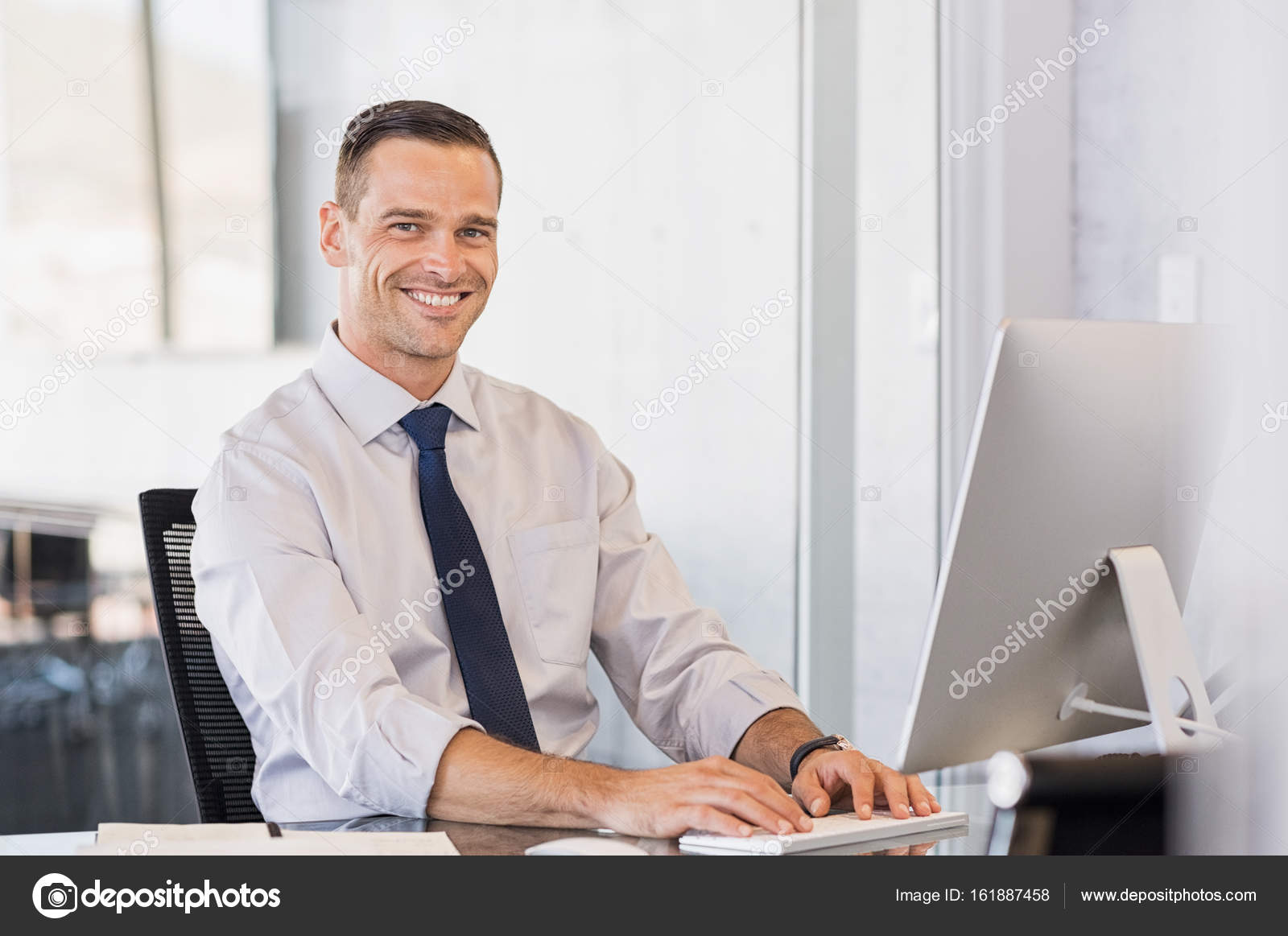 Businessman smiling at computer — Stock Photo © ridofranz #161887458 Businessman smiling at computer — Stock Photo © ridofranz #161887458