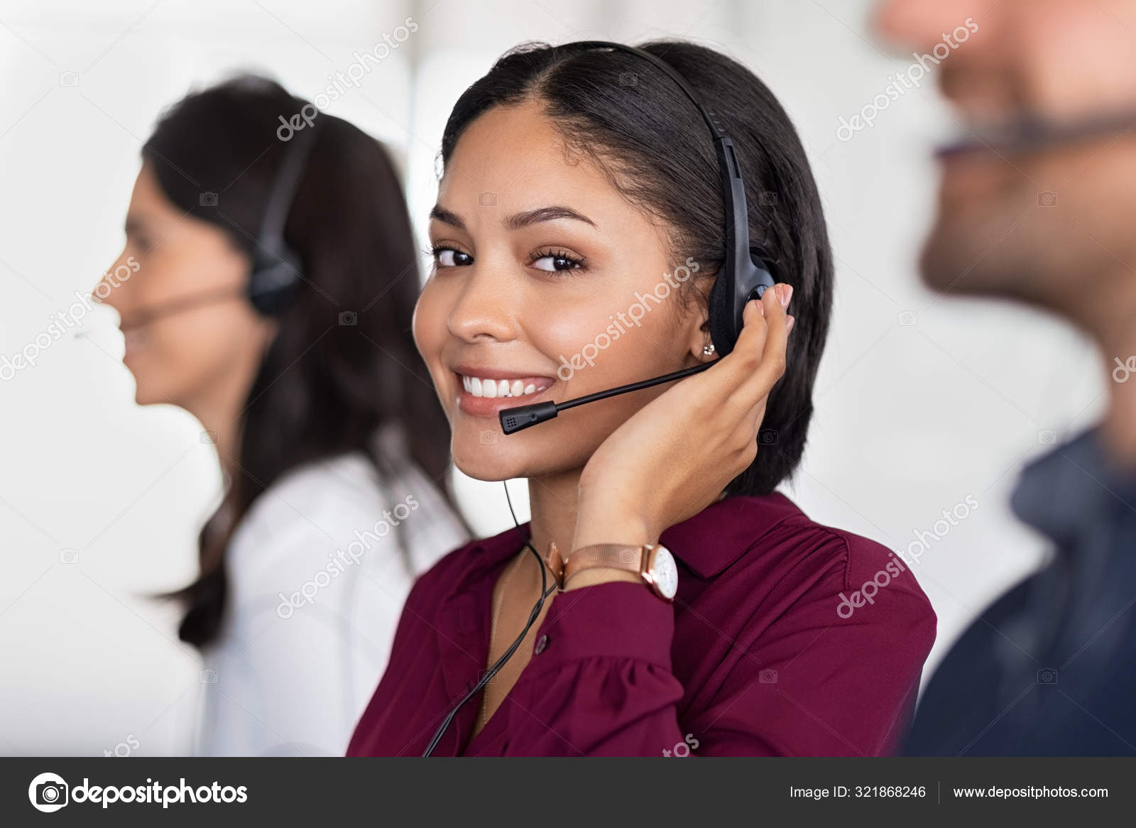 Young latin woman in customer service center — Stock Photo © ridofranz ...