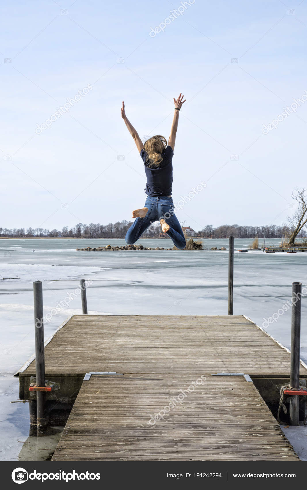 Kid jumping by the water Stock Photo by ©ankihoglund 191242294