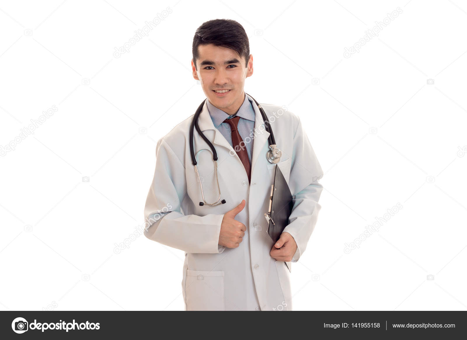 Young elegant doctor in uniform with stethoscope smiling on camera with ...