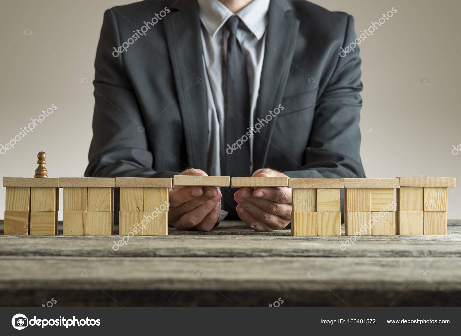 Building bridge to span a gap for chess piece pawn Stock Photo by ...