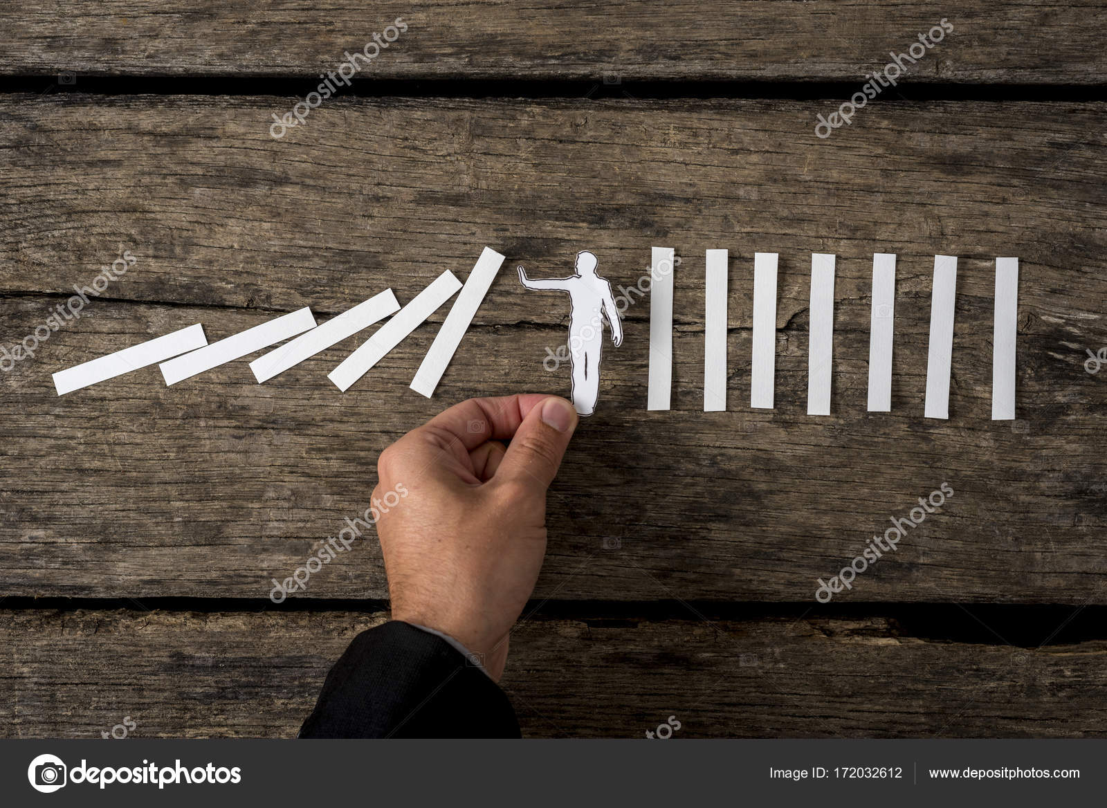 Man moving small white flat figure on wood — Stock Photo © Gajus-Images ...