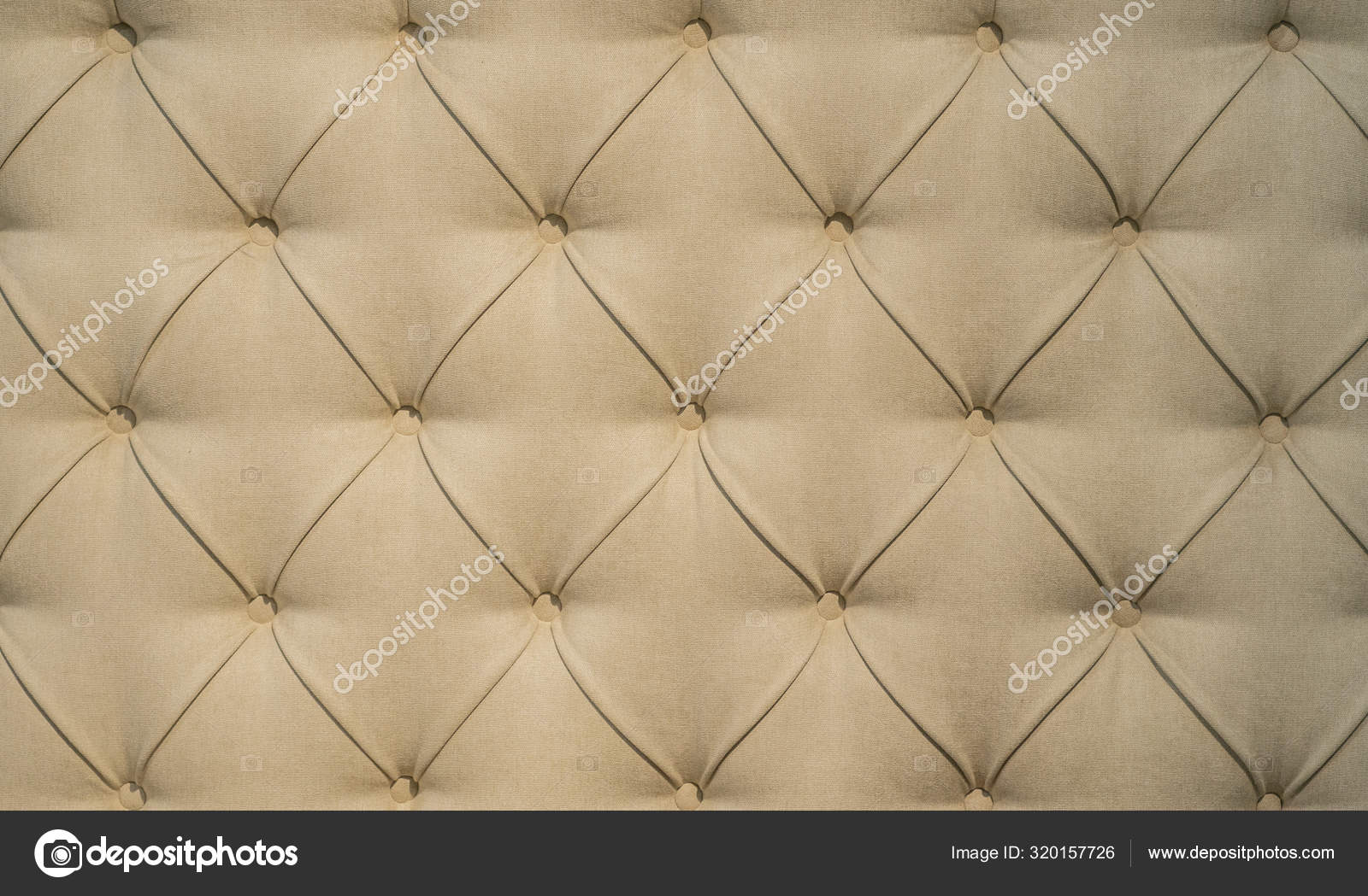 Chesterfield style quilted upholstery backdrop close up. Capitone ...
