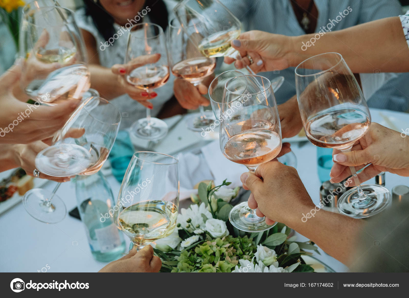 Many Hands toasting with glasses of wine at a celebration — Stock Photo ...