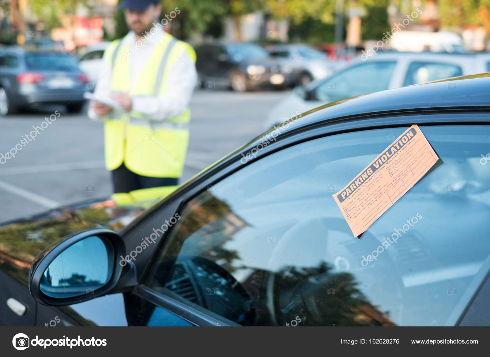 Police officer giving a fine for parking violation Stock Photo by ...