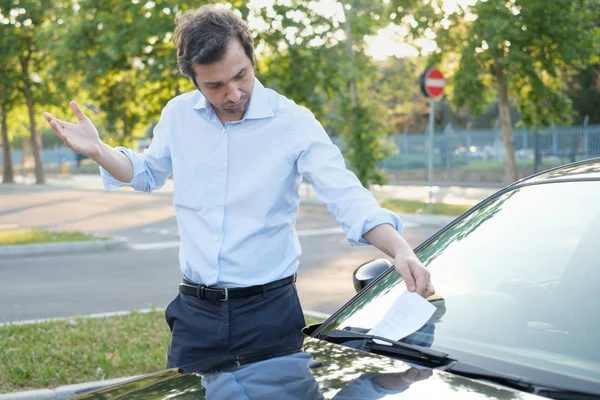 Parking violation ticket fine on windshield Stock Photo by ©tommaso1979 ...