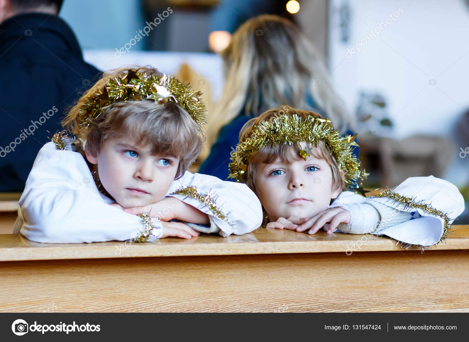 Two little boys as angels of Christmas story eve in church Stock Photo ...