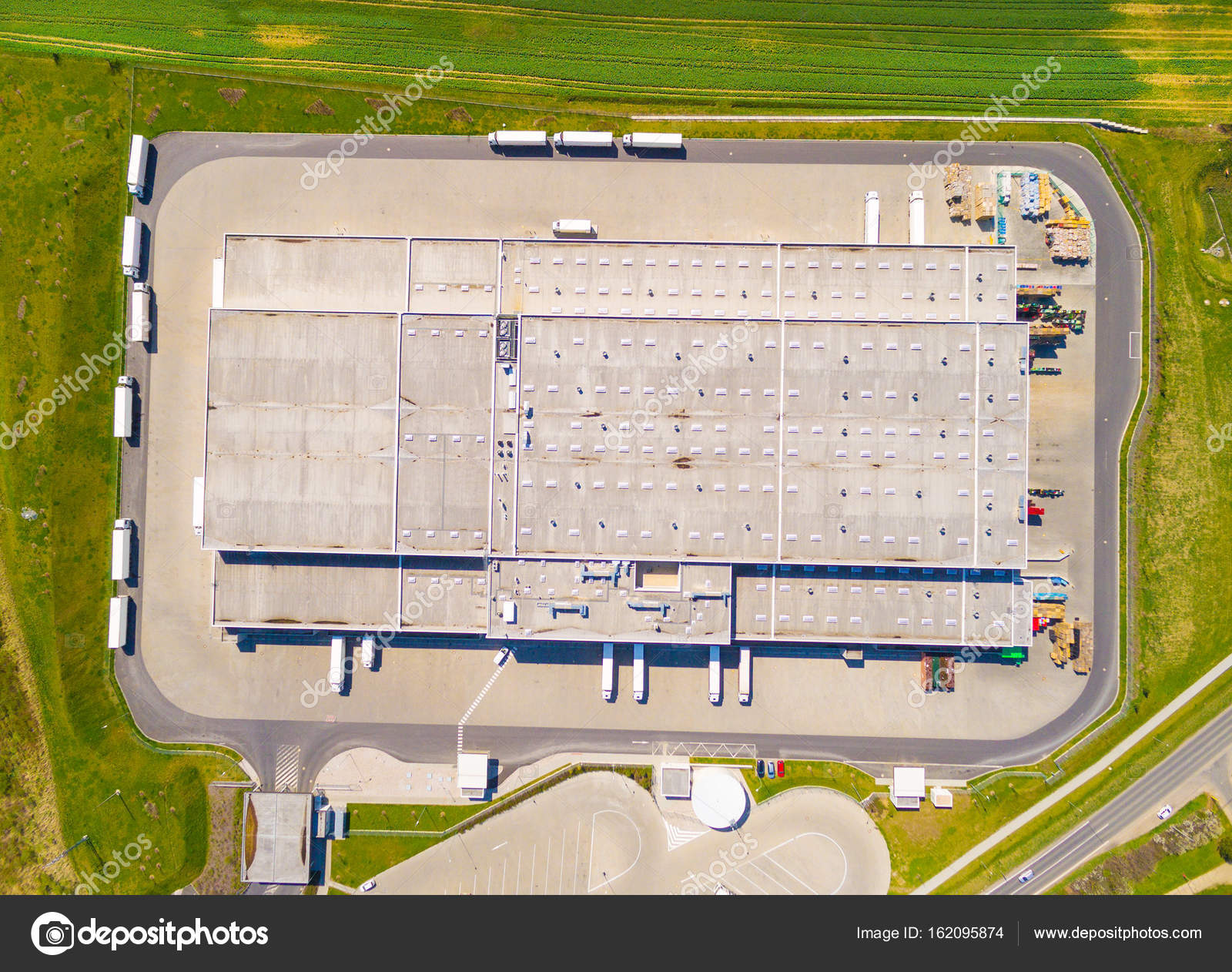 Storage and freight terminal with trucks — Stock Photo © vladvitek ...