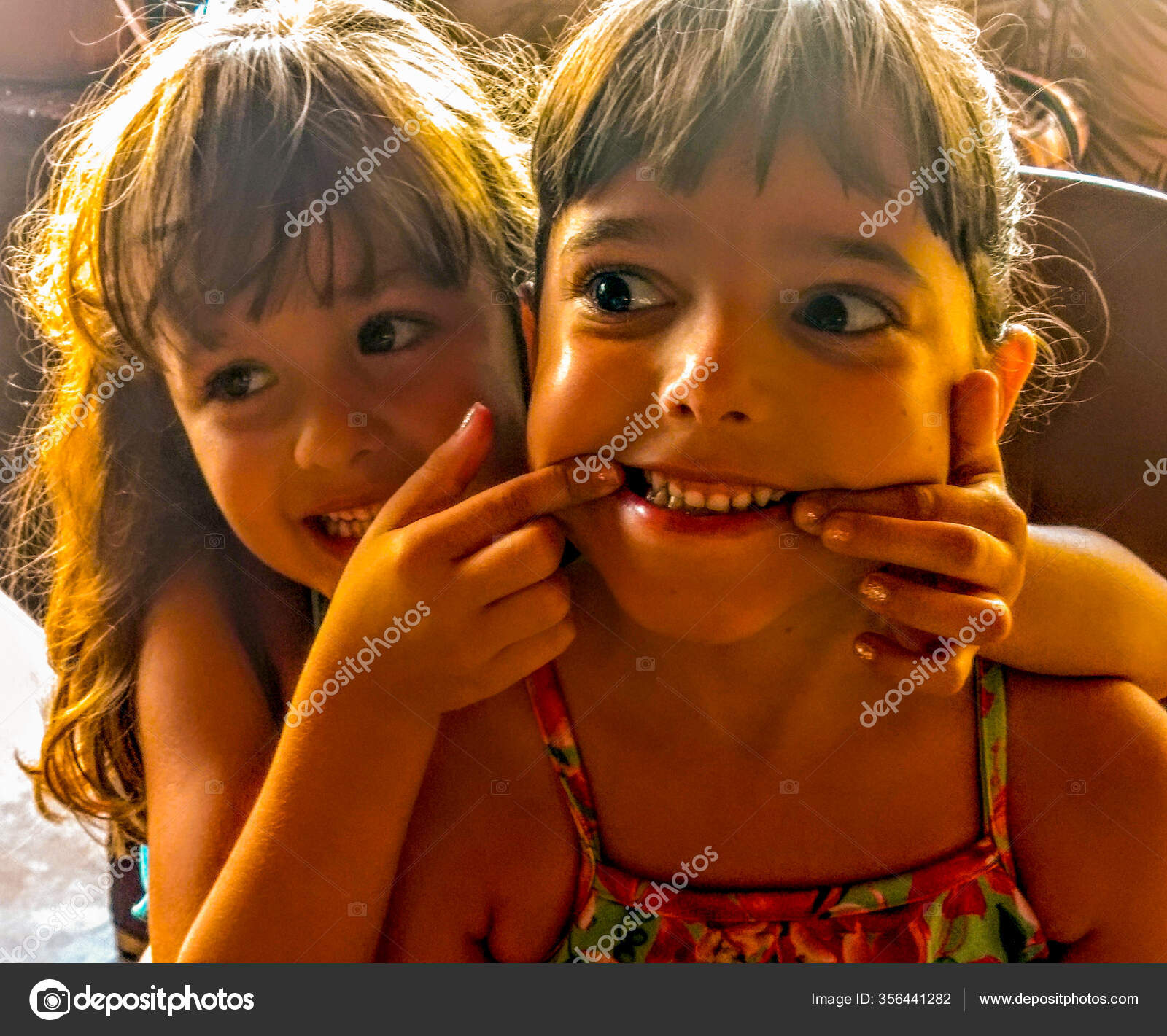 Two Kids Playing Grimacing Smiling — Stock Photo © ClaudioPadiar #356441282