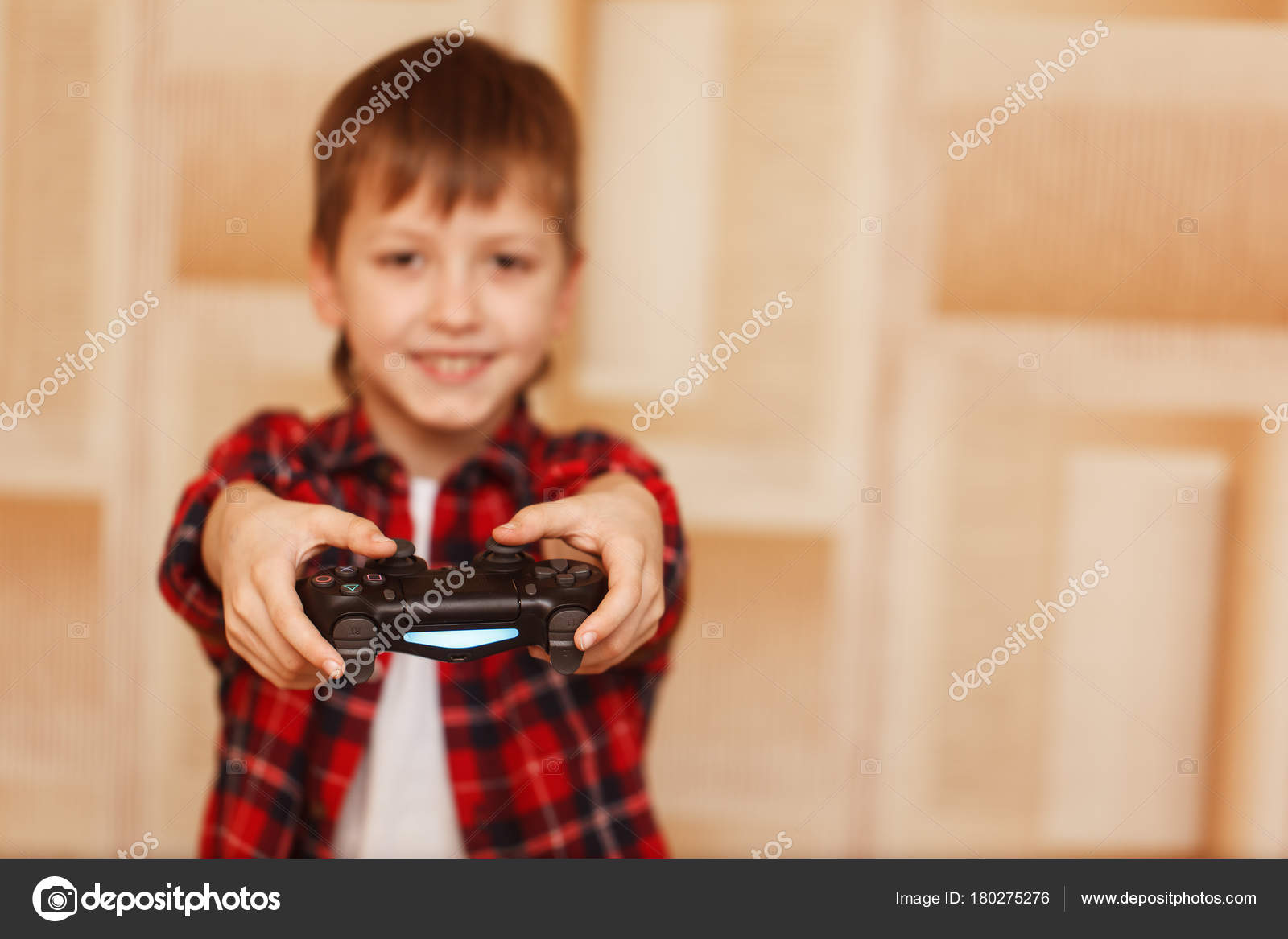 Young boy holding game controller playing video games. — Stock Photo ...
