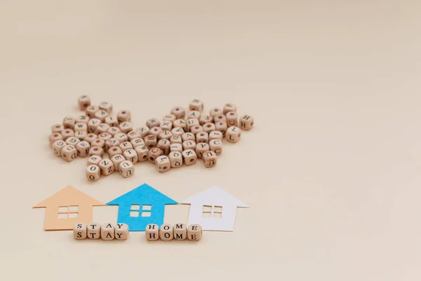Words stay at home made of wooden blocks and paper house , social ...