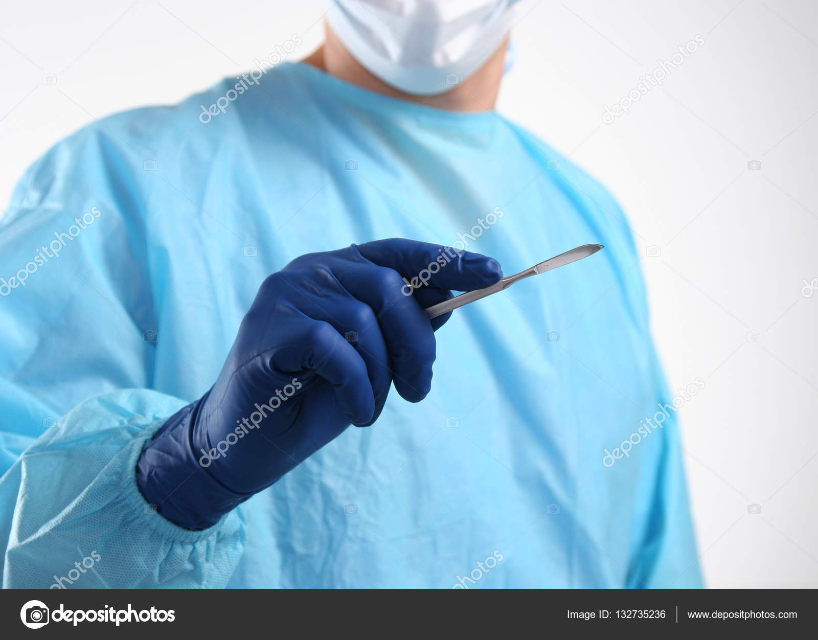 Surgeon hand hold scalpel and tweezers while cut cure wound closeup ...