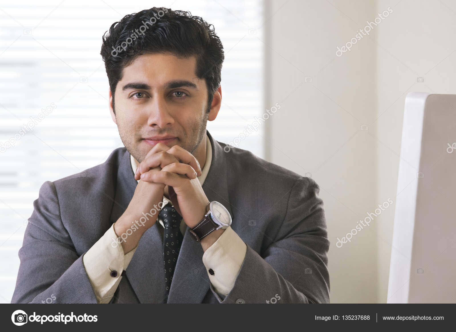 Smiling businessman posing — Stock Photo © iphemant #135237688 Smiling businessman posing — Stock Photo © iphemant #135237688
