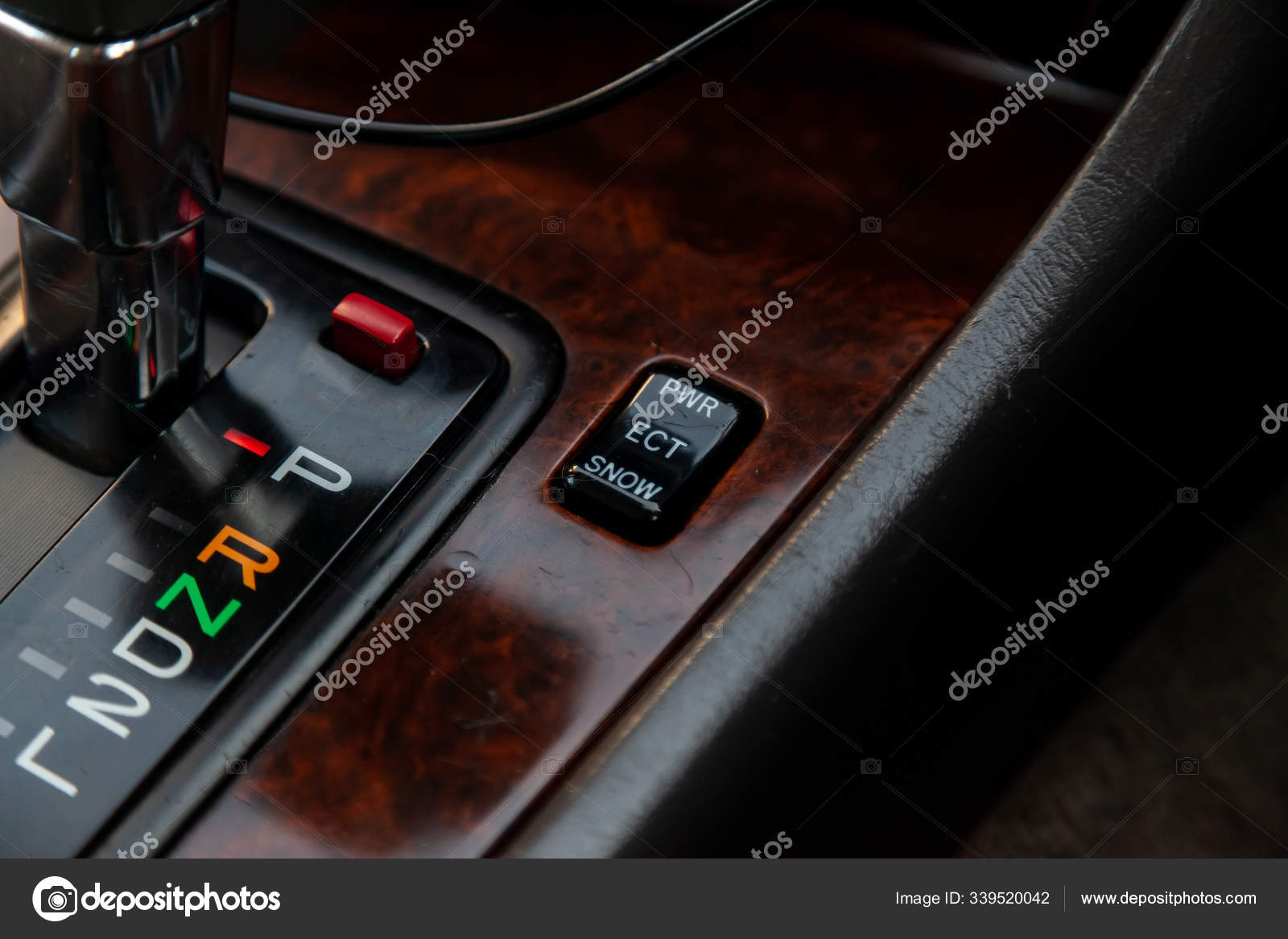 The car panel is next to the speed switch with letters designati ...