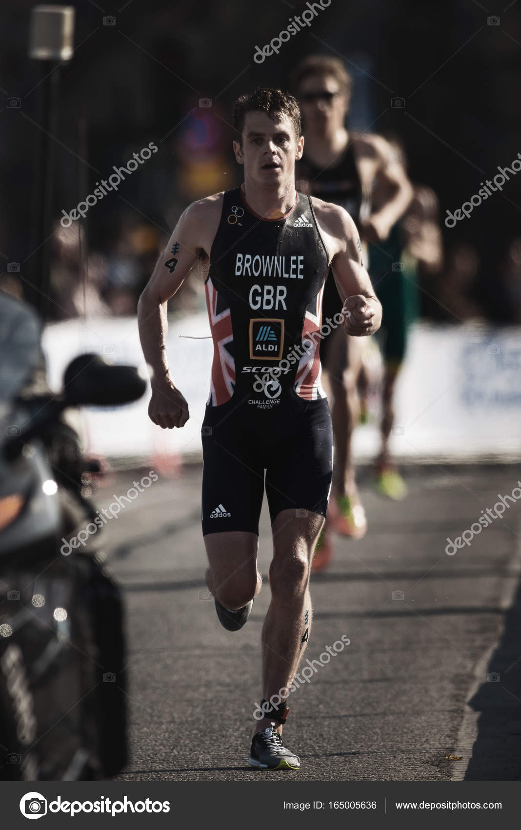 Jonathan Brownlee (GBR) running trough the streets of the old ci ...