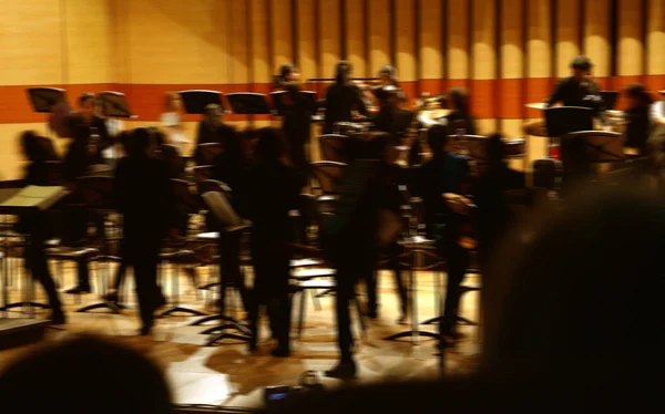 abstract blurred image. Artists symphony orchestra. Musician plays a ...