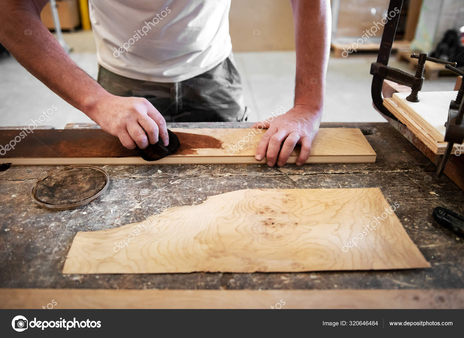 Carpenter applying stain to a briar root panel — Stock Photo ...