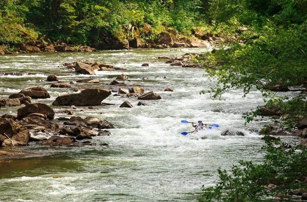 Two people floating in a canoe on a mountain river ⬇ Stock Photo, Image ...