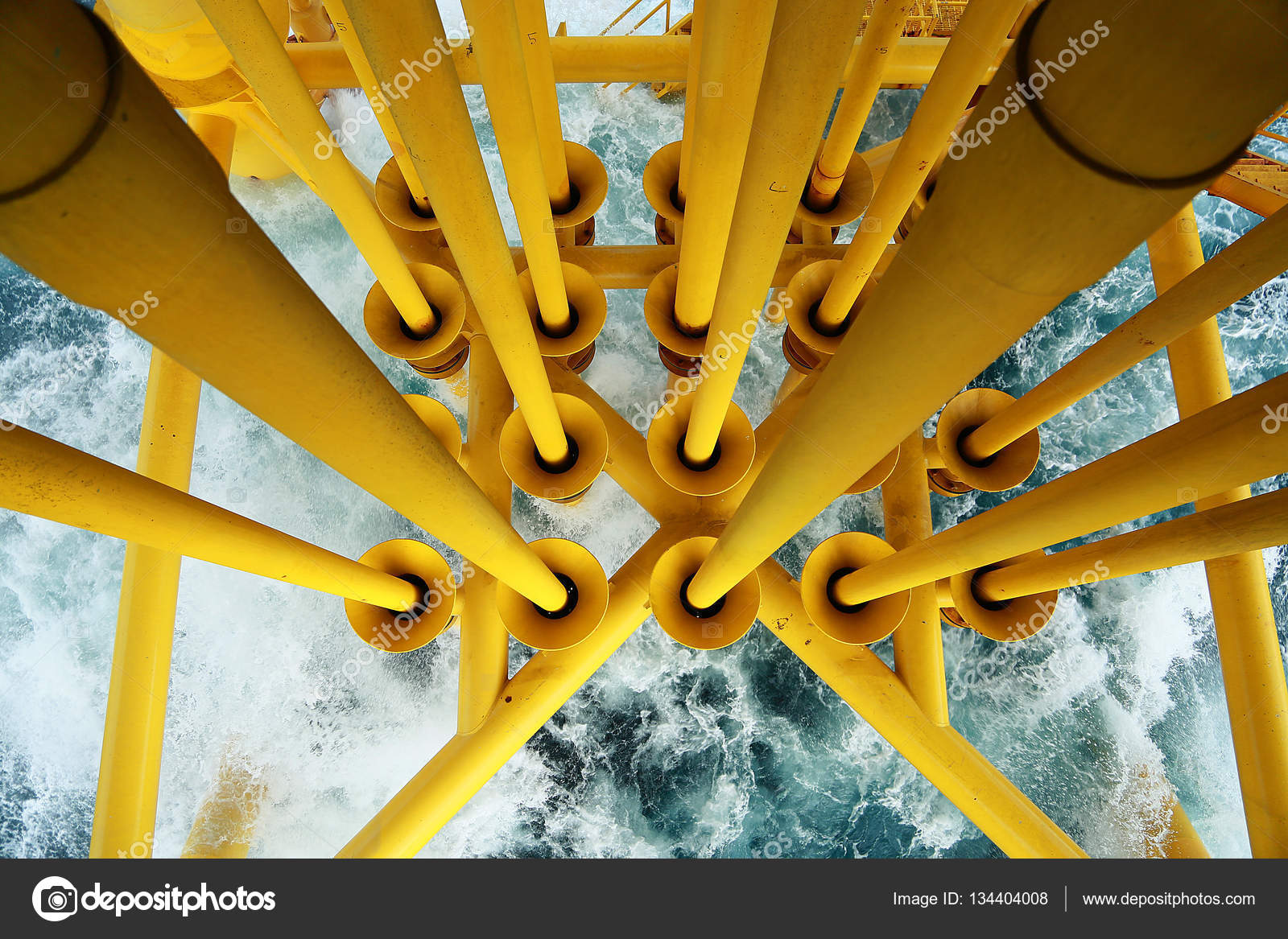 Well head slot from ground to main production floor and controlled by ...