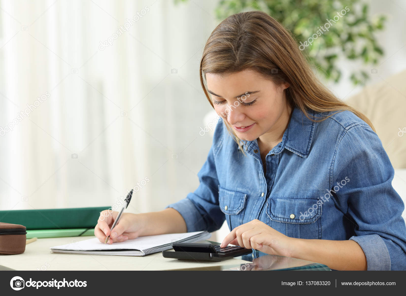 Student studying calculating with a calculator Stock Photo by ...