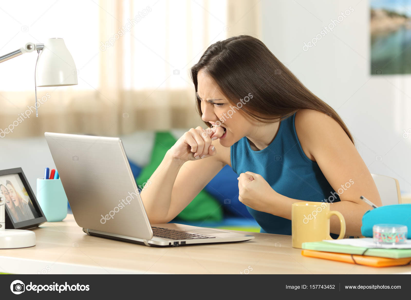Angry student with a laptop in her room — Stock Photo © AntonioGuillemF ...