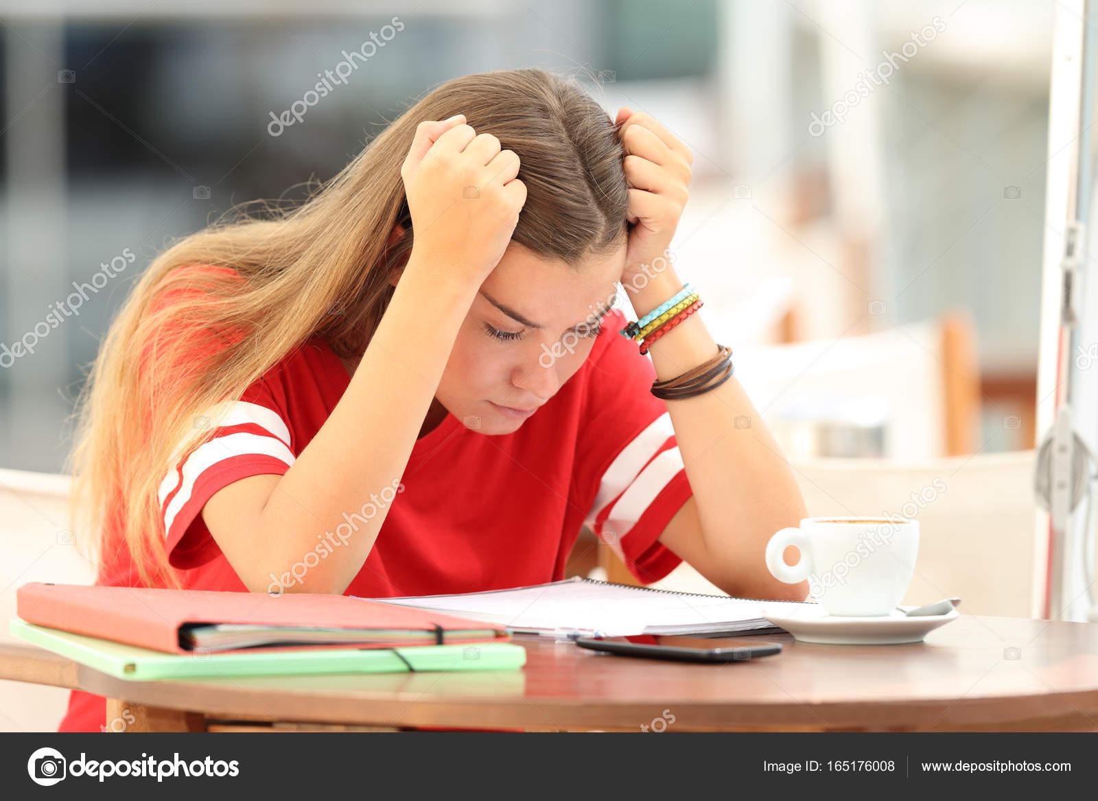 Frustrated student trying to understand notes in a bar — Stock Photo ...