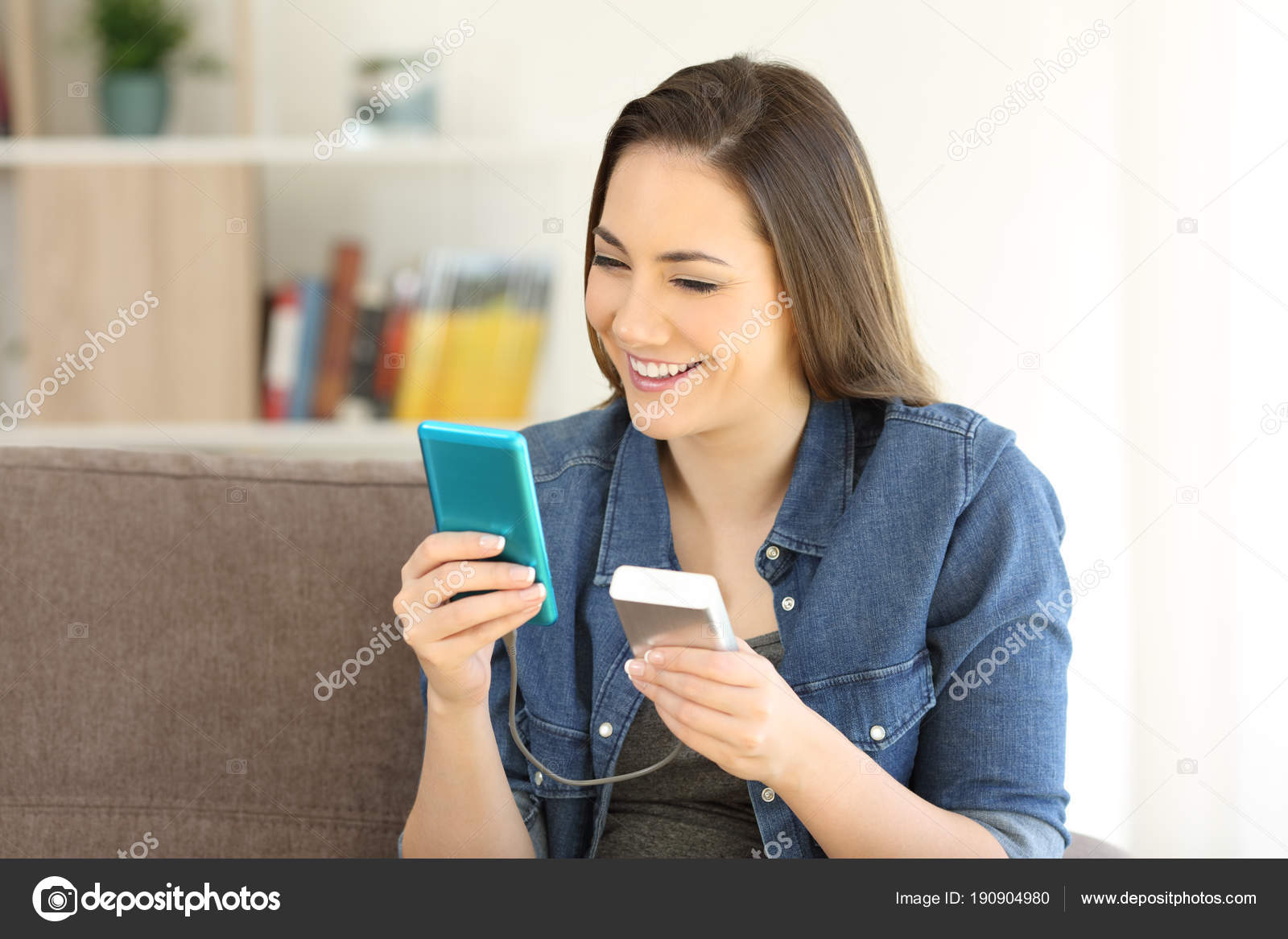 Woman charging phone with a portable charger — Stock Photo ...