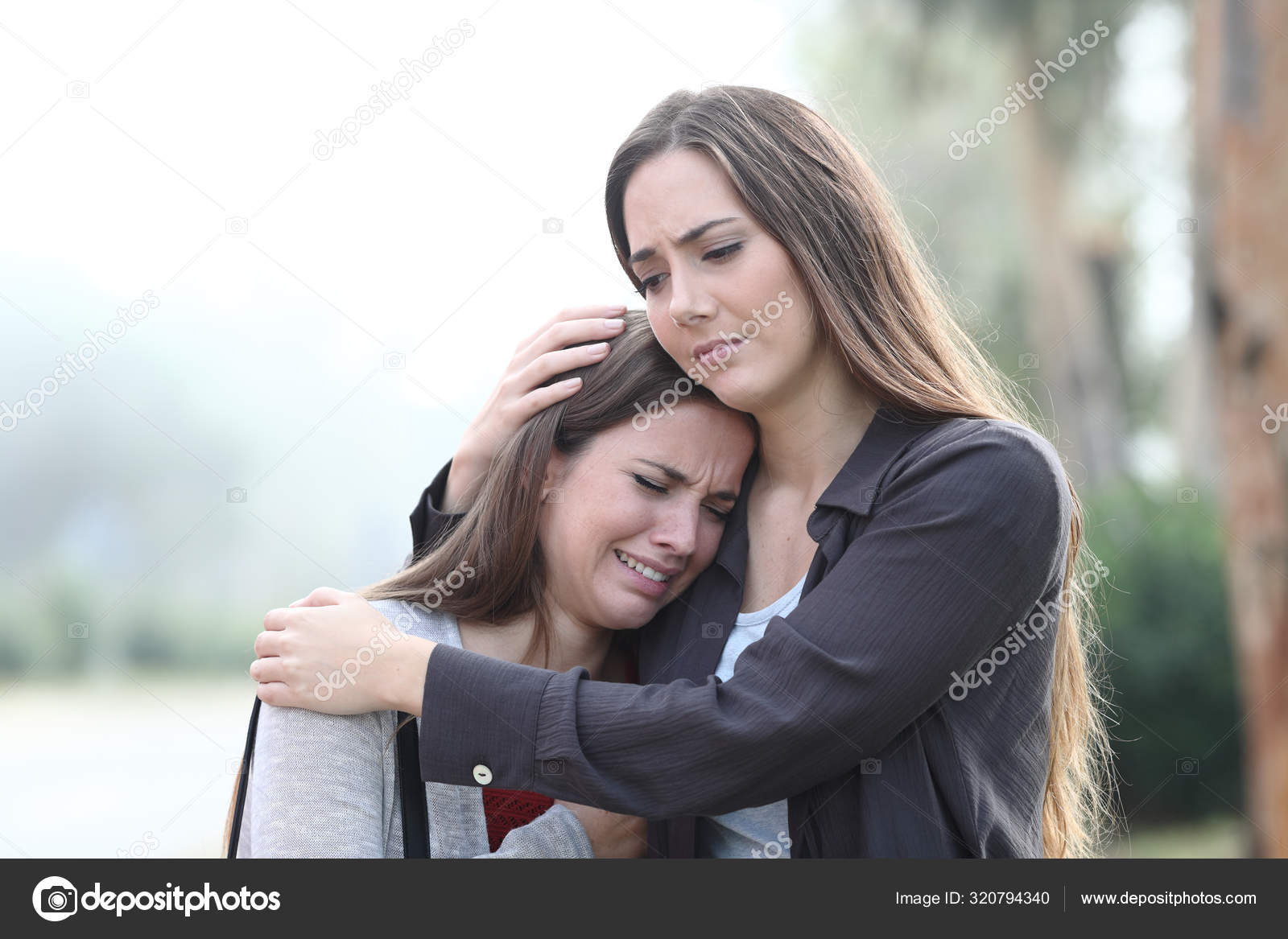 Two Sad Girls Hugging