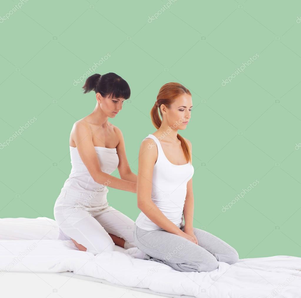 Woman getting thai stretching massage — Stock Photo © shmeljov #136040070