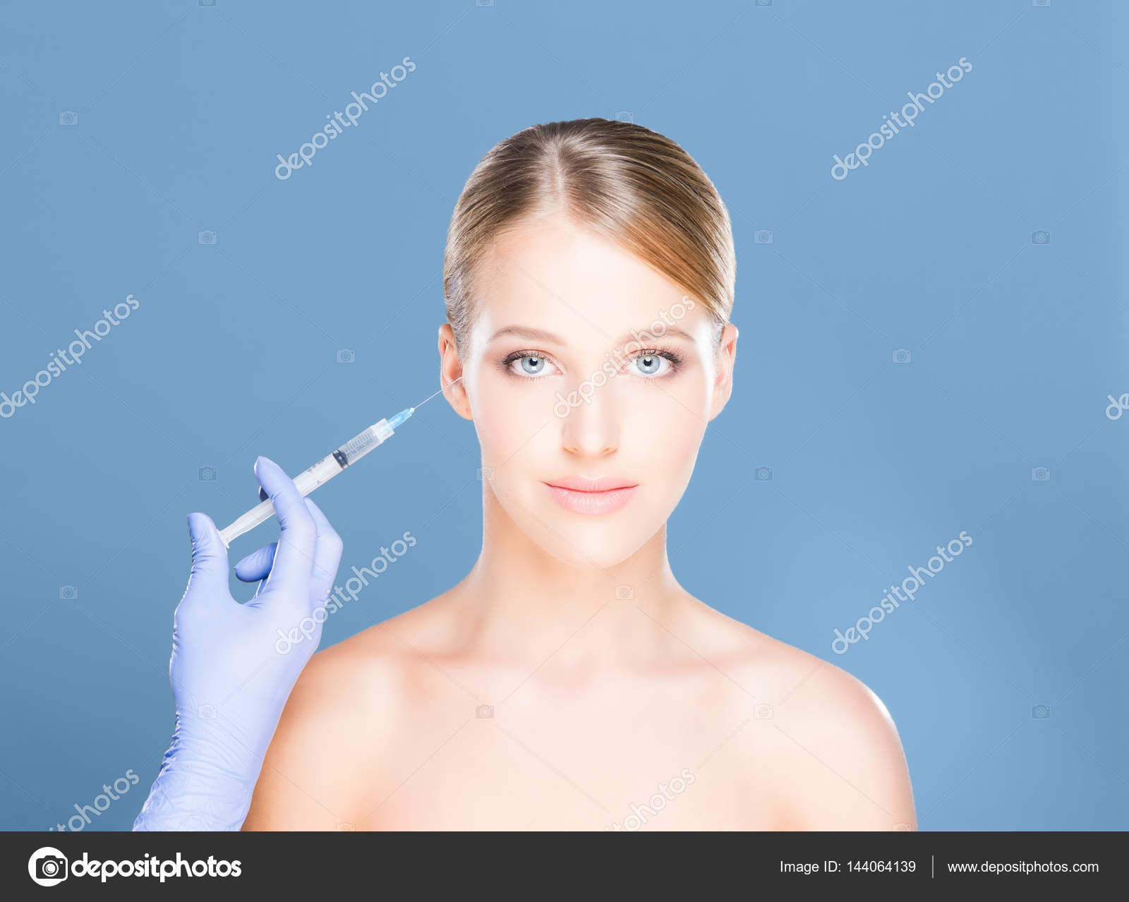 Doctor making injection into face of woman Stock Photo by ©shmeljov ...