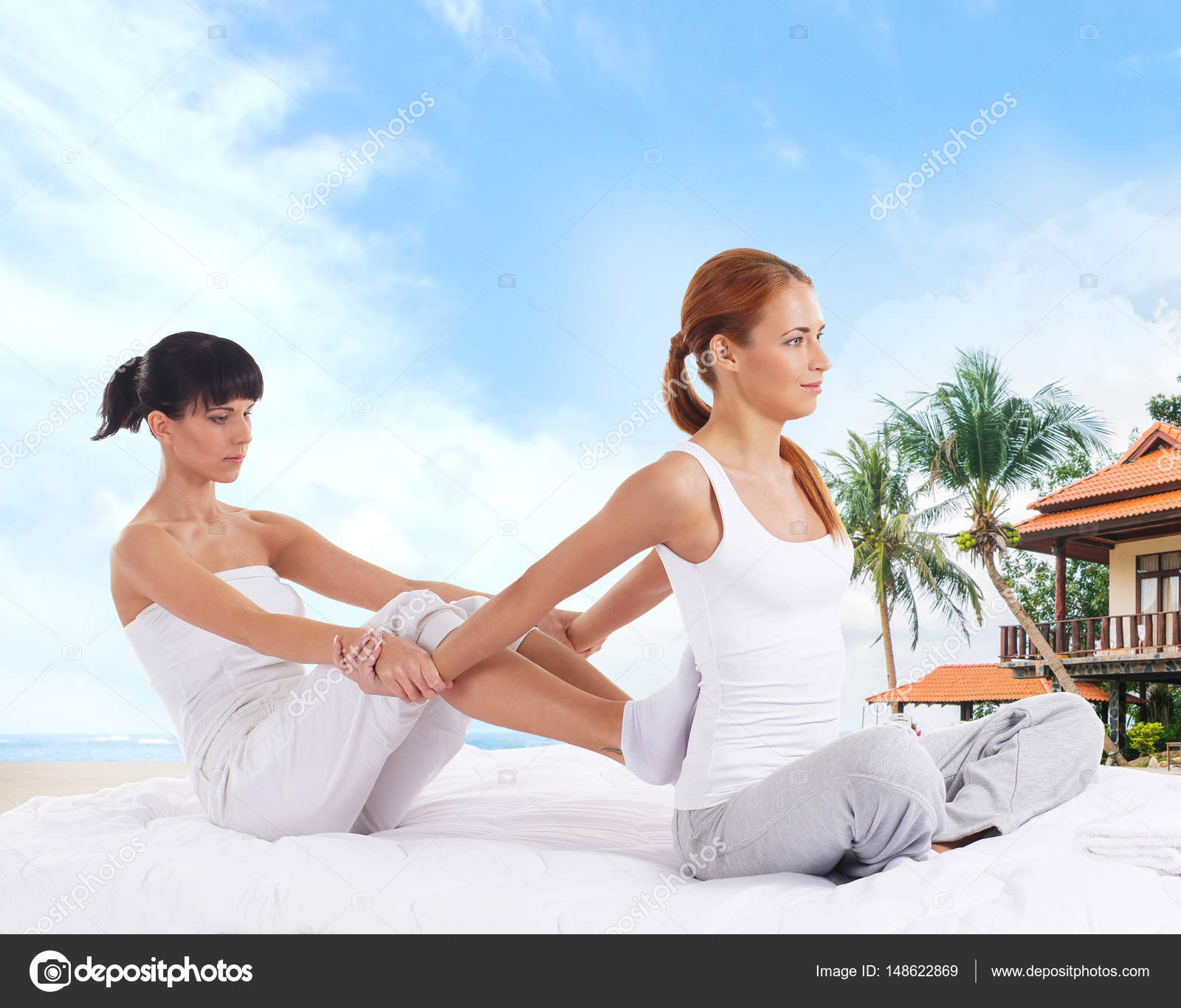 Woman getting thai stretching massage — Stock Photo © shmeljov #148622869
