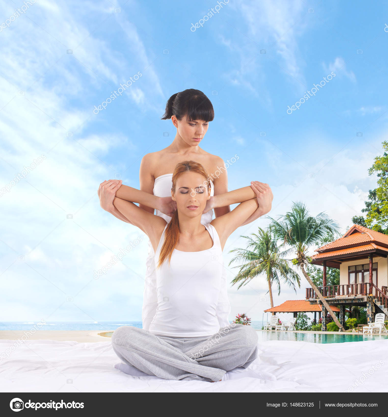 Woman getting thai stretching massage — Stock Photo © shmeljov #148623125