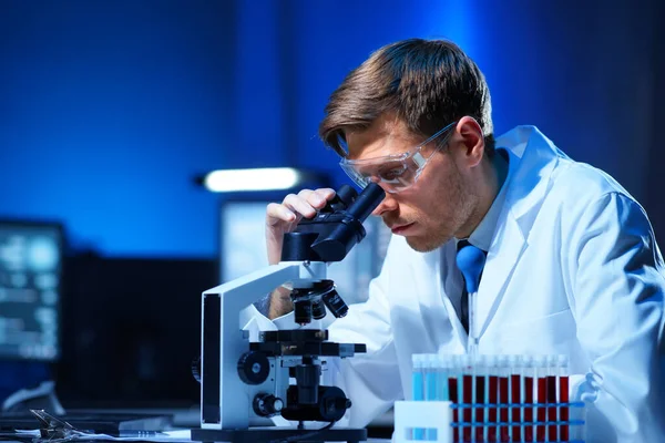 Scientist working in lab. Doctor making microbiology research ...