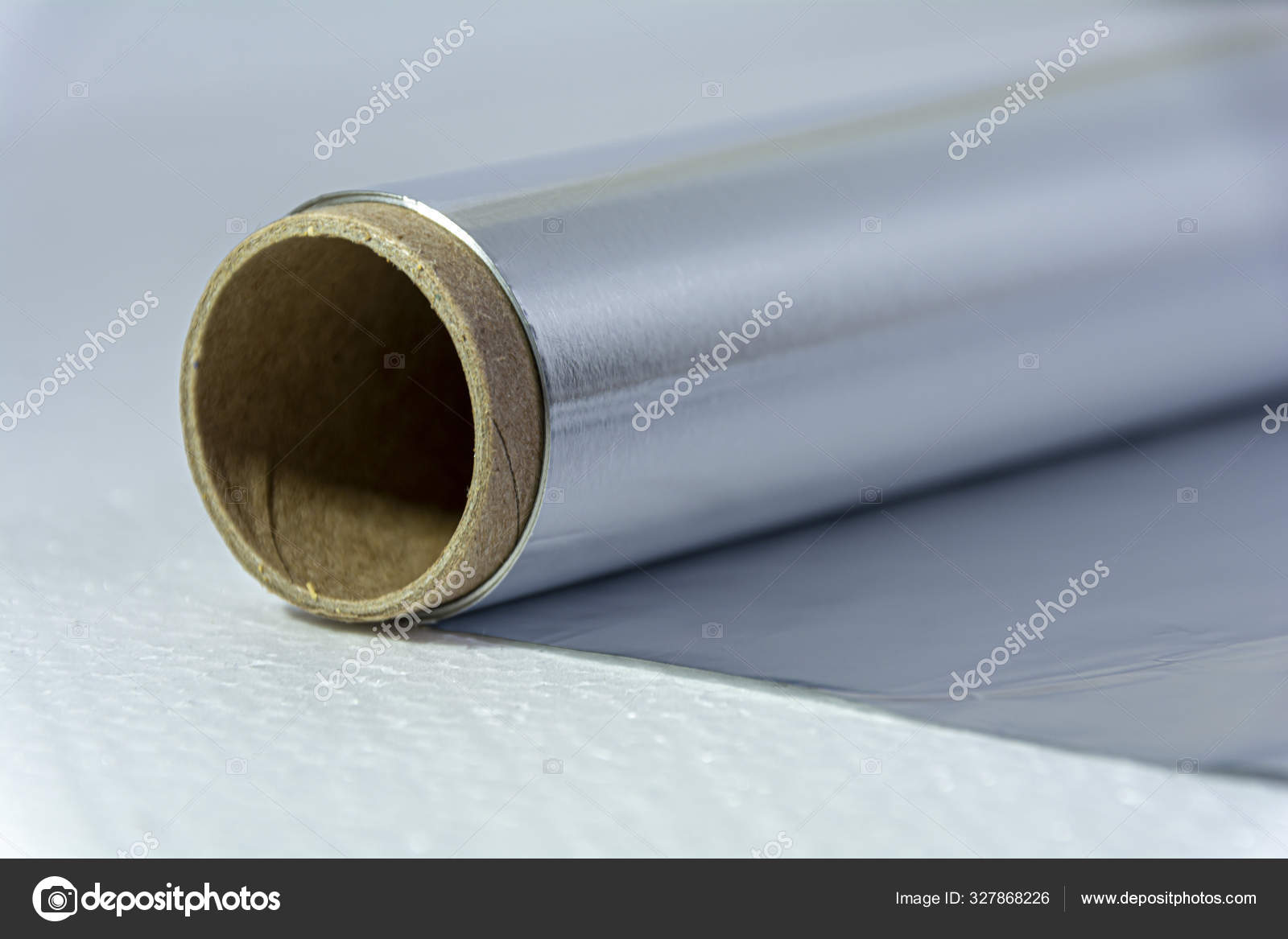 Close-up aluminum foil for baking and baking. Food foil roll, side view ...