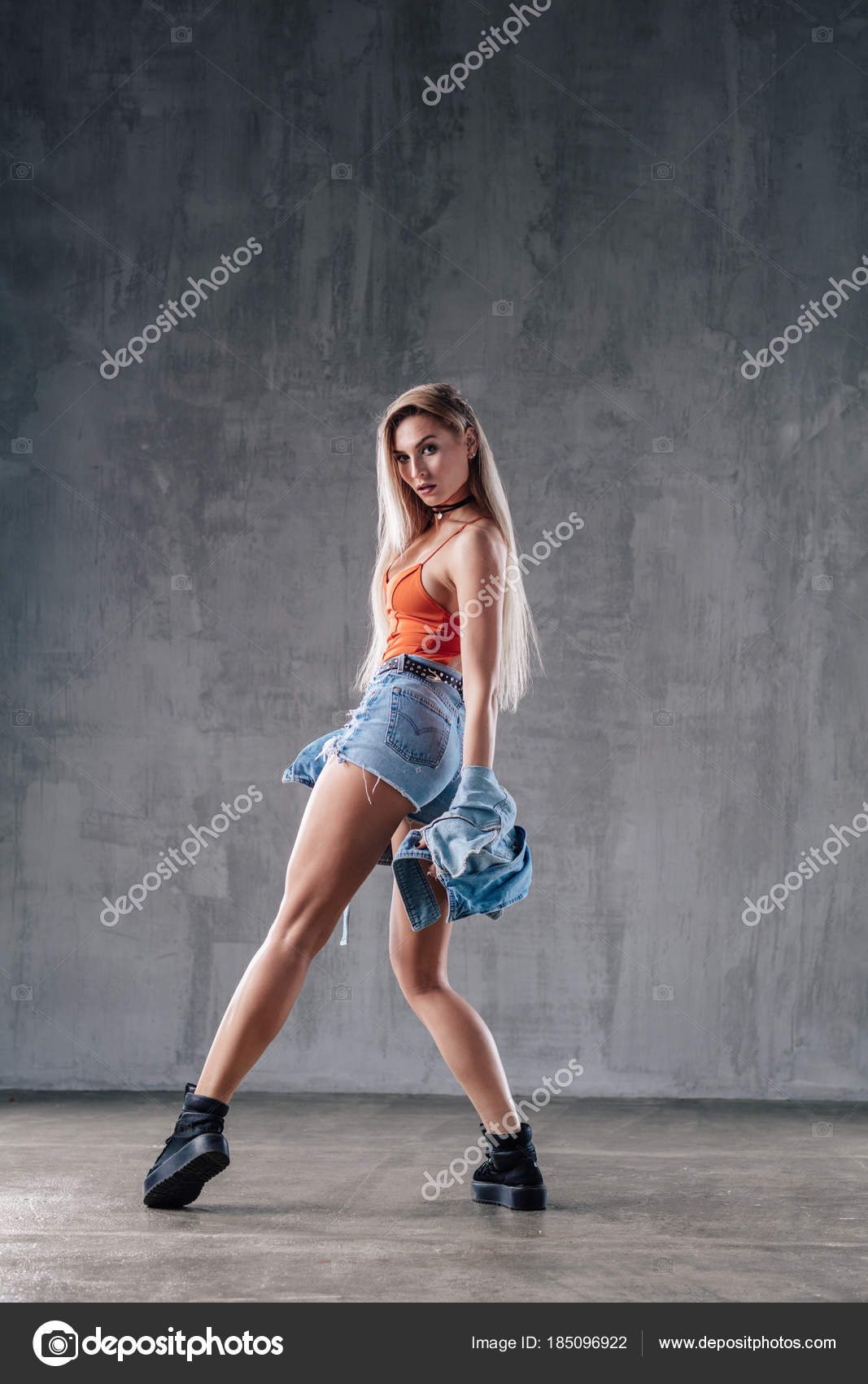 Young beautiful female dancer is posing in the studio — Stock Photo ...