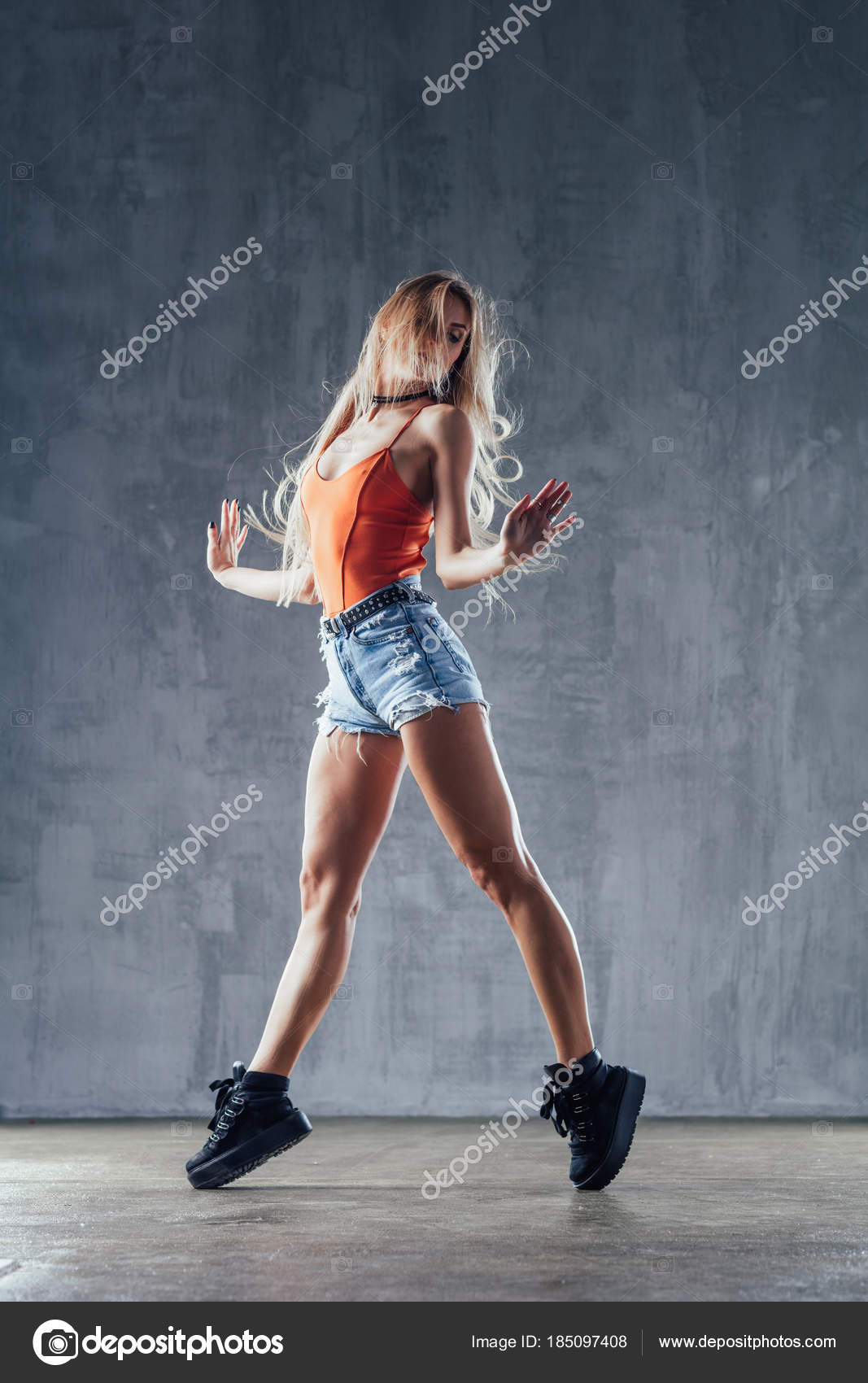 Young beautiful female dancer is posing in the studio — Stock Photo ...