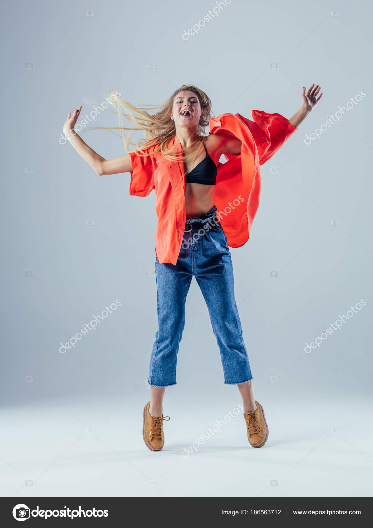 Young beautiful female dancer is posing in the studio — Stock Photo ...