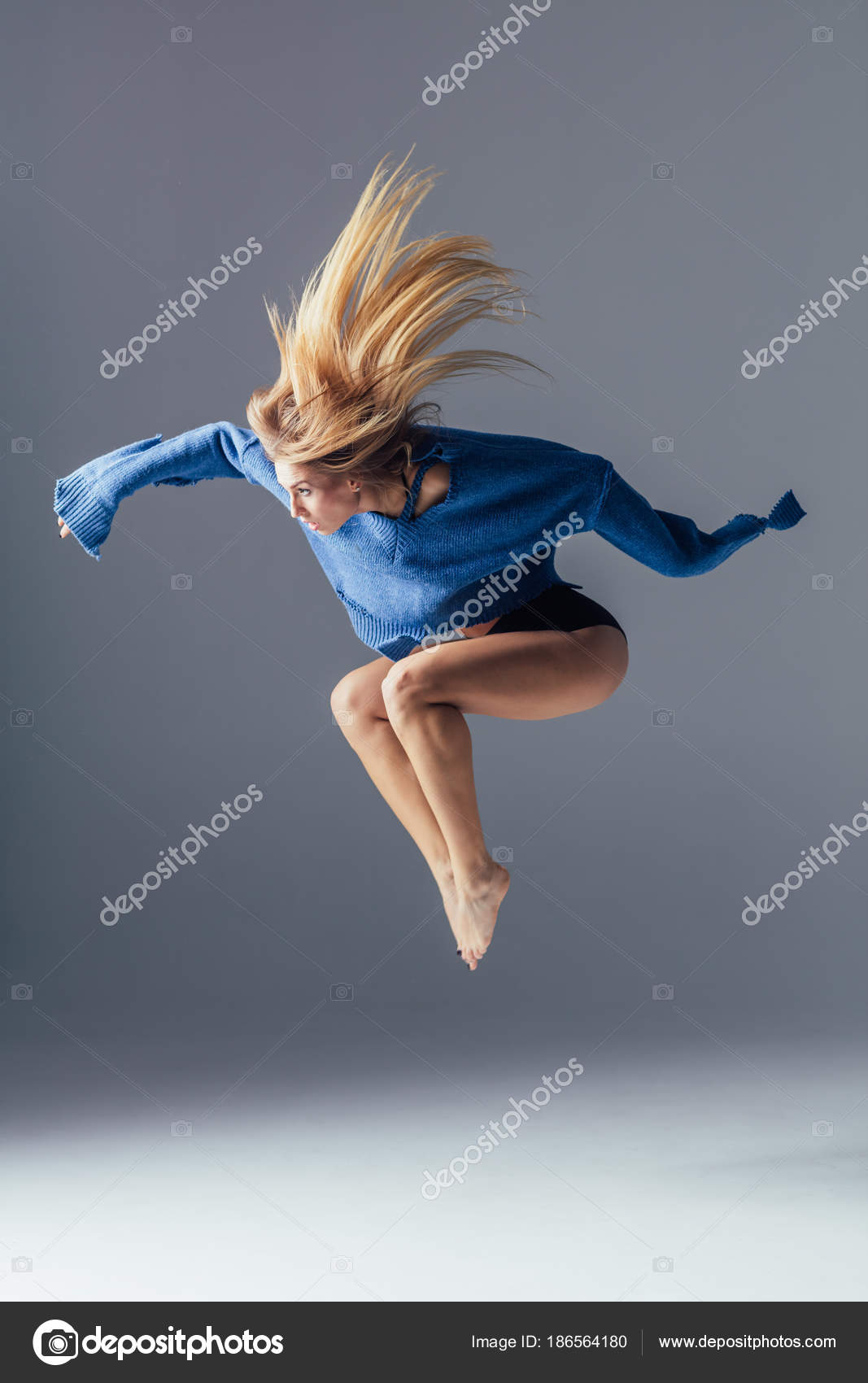 Young beautiful female dancer is posing in the studio ⬇ Stock Photo ...