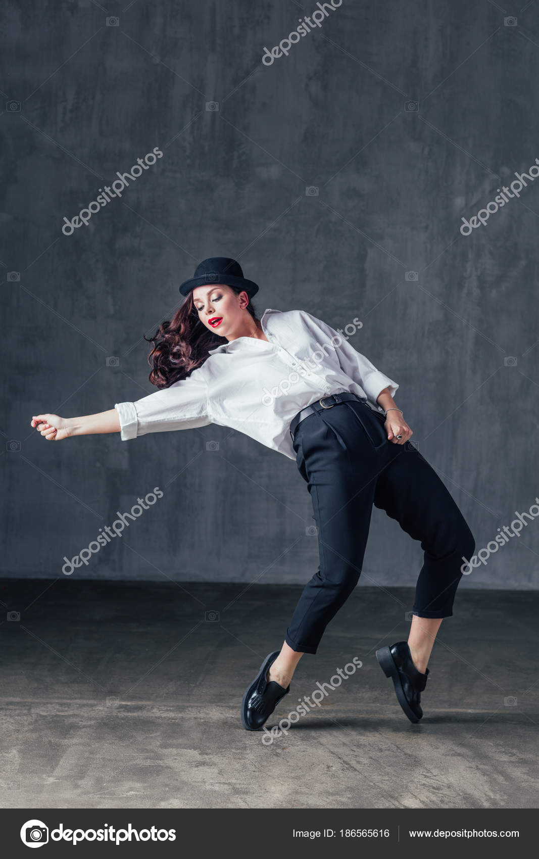 Young beautiful female dancer is posing in the studio — Stock Photo ...